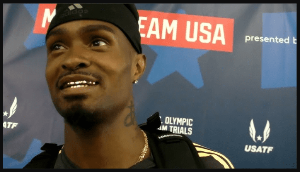 Quincy Hall's Smile Blinds the Crowd with His Golden Teeth!